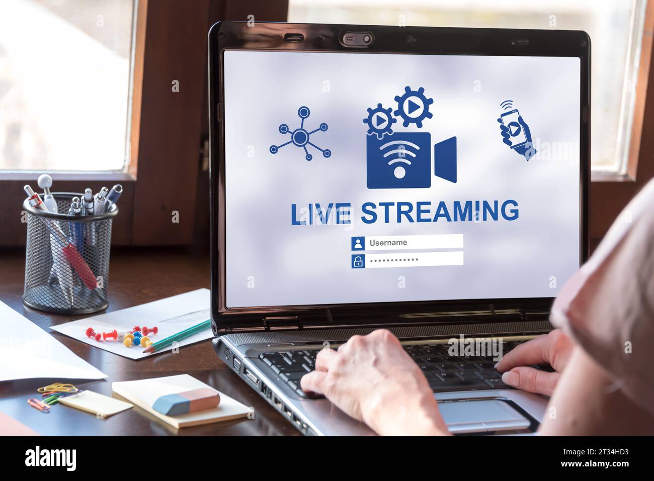 Laptop screen displaying a live streaming concept Stock Photo - Alamy