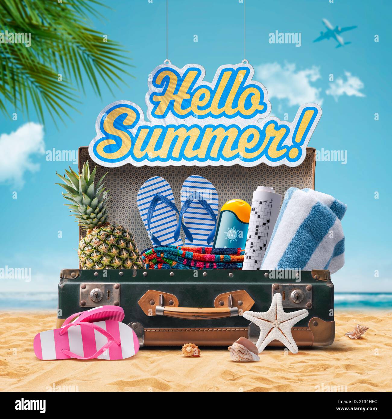 Vintage style suitcase with assorted beach accessories, summer ...