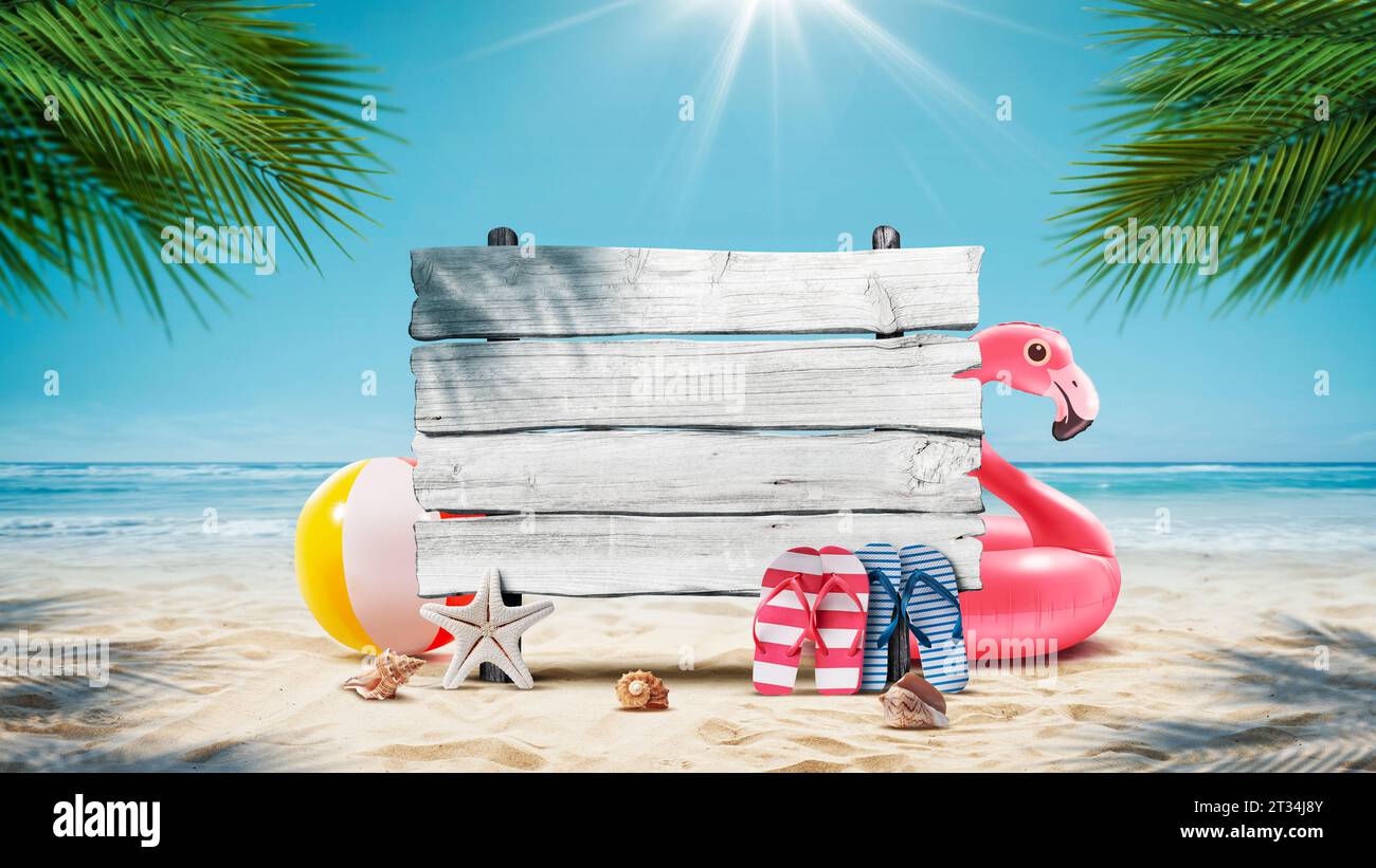 Old wooden sign and colorful beach accessories on the sand, tropical ...