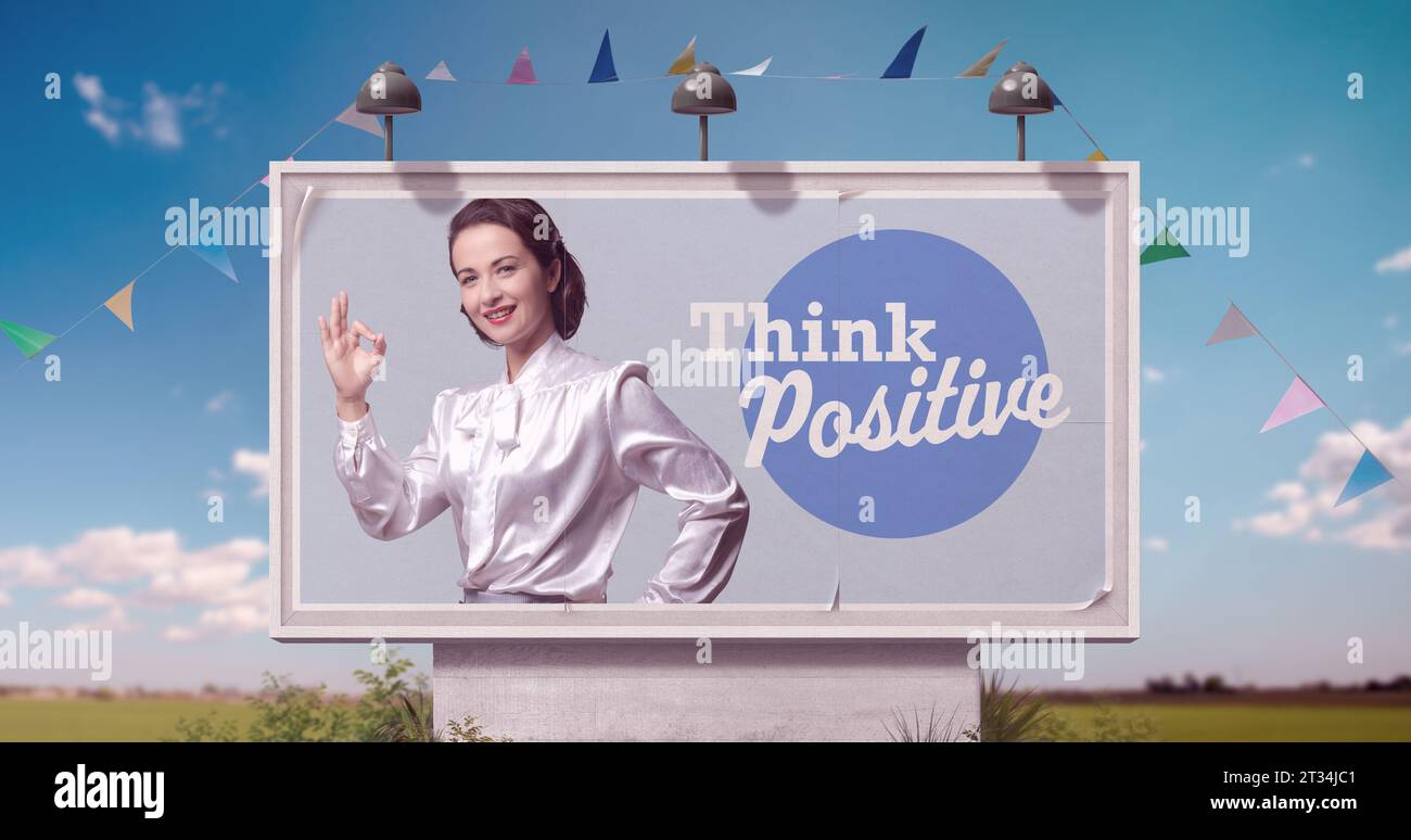 Happy woman with positive mood on billboard advertisement and ...