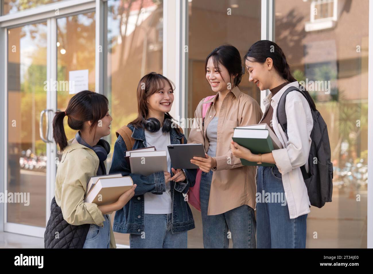 Happy young student chat with each other after class. Guy and girls ...
