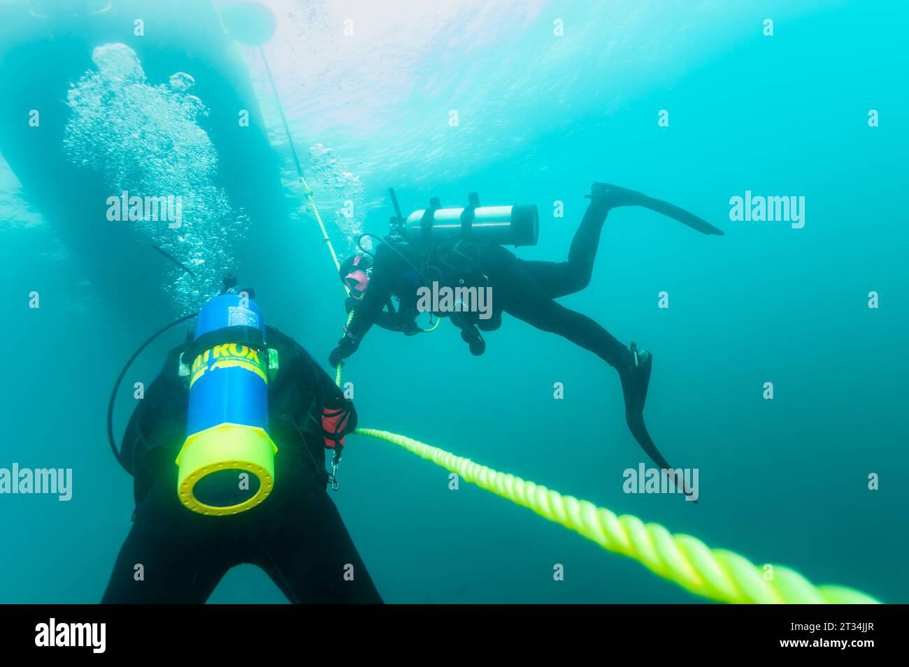 Munising, MI - August 11, 2023: Scuba divers at a safety stop holding ...