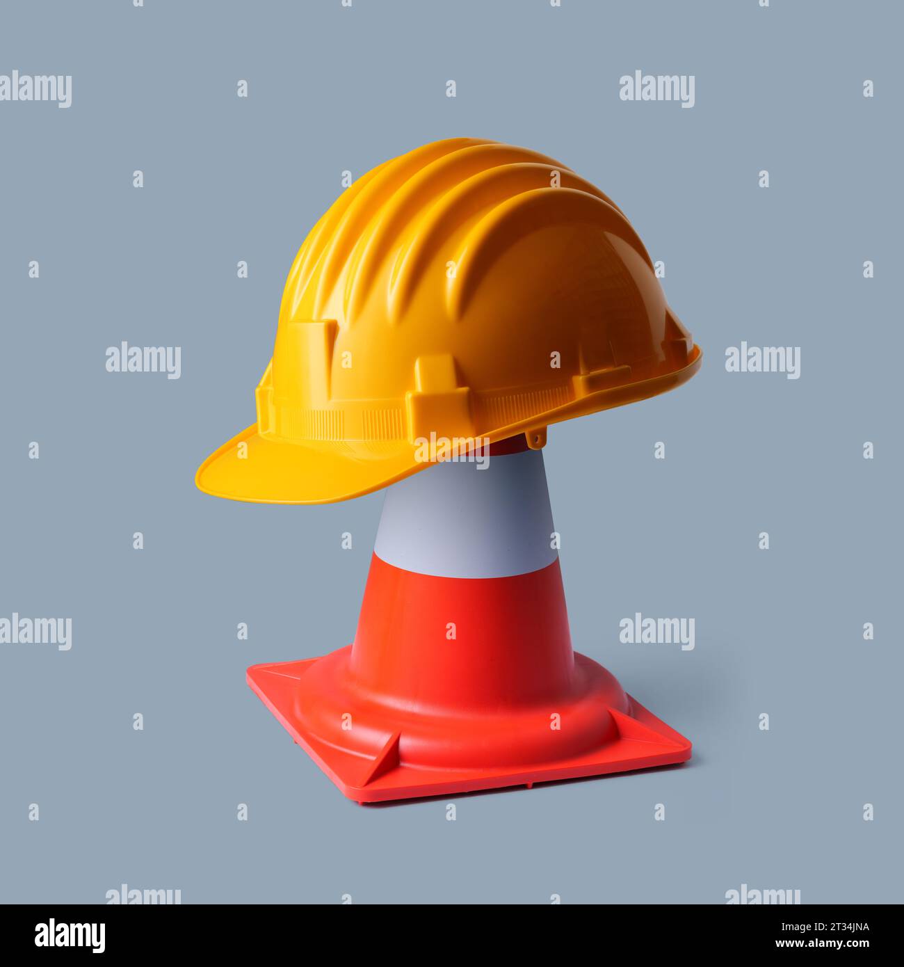 Safety helmet and traffic cone: safety at work concept Stock Photo - Alamy