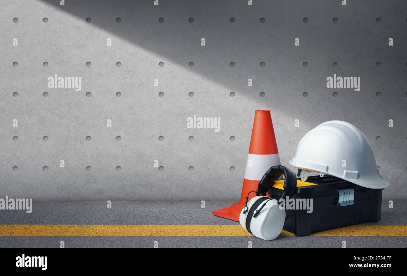 Construction worker tools and safety equipment: toolbox, hard hat, ear ...