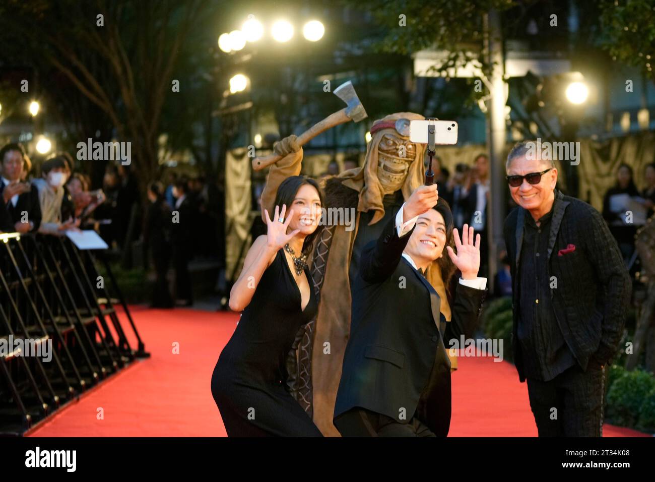 Actors of "Lumberjack the Monster" pose for a selfie on the red carpet ...