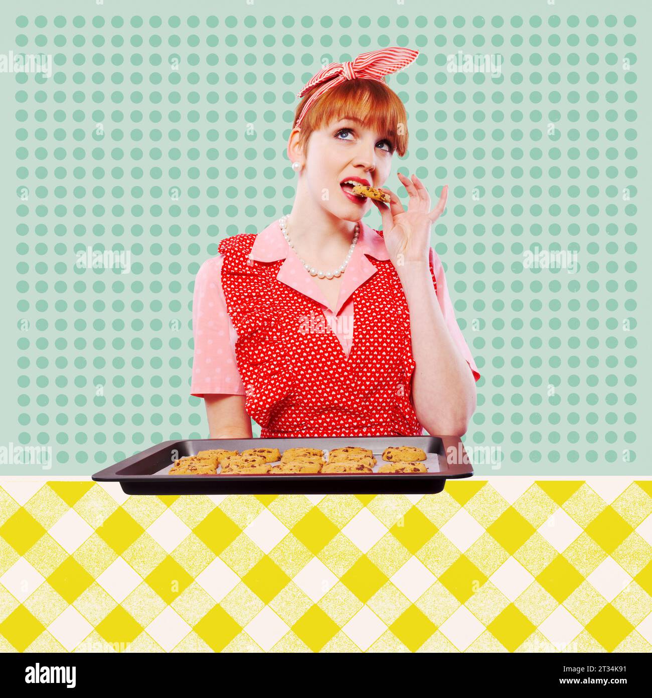 Happy vintage style housewife tasting her freshly baked homemade sweets ...