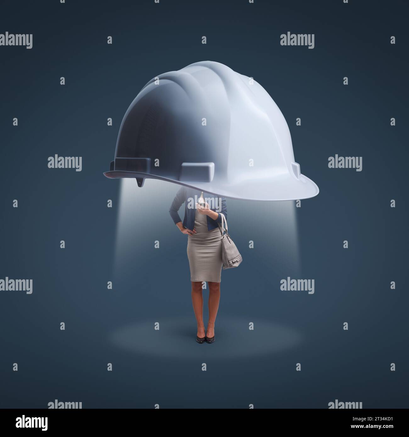 Big safety helmet protecting a woman using a smartphone: data ...