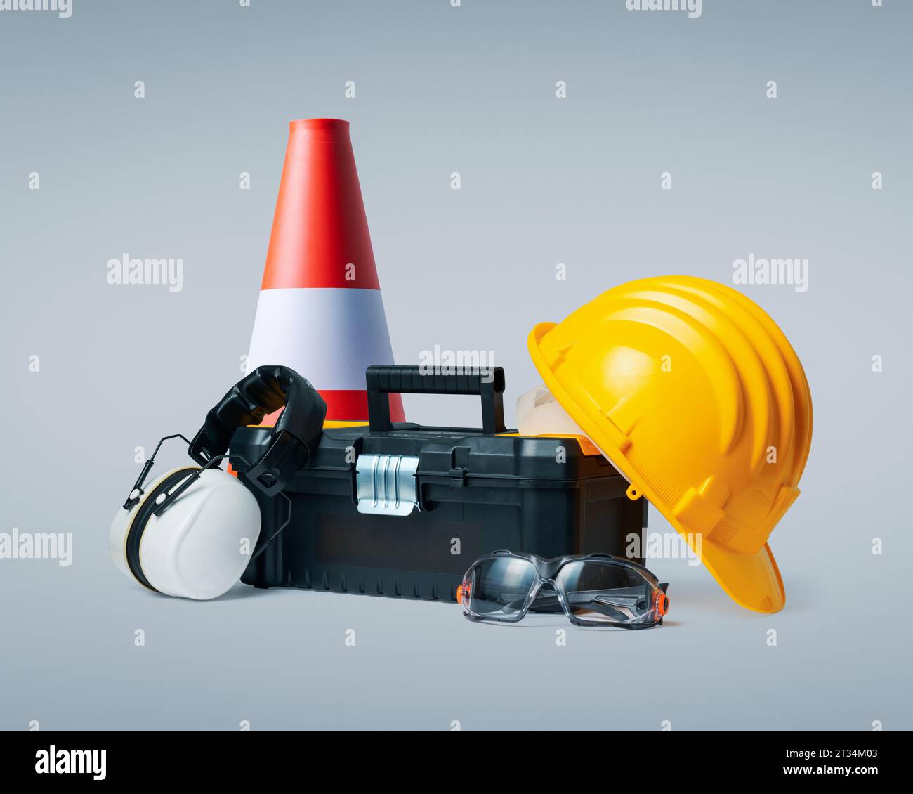 Construction worker tools and safety equipment: toolbox, hard hat, ear ...