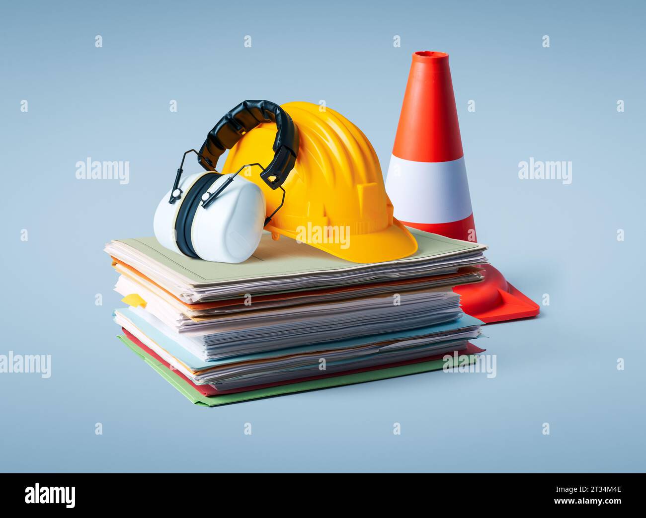 Pile of paperwork, safety equipment and work tools: construction and ...
