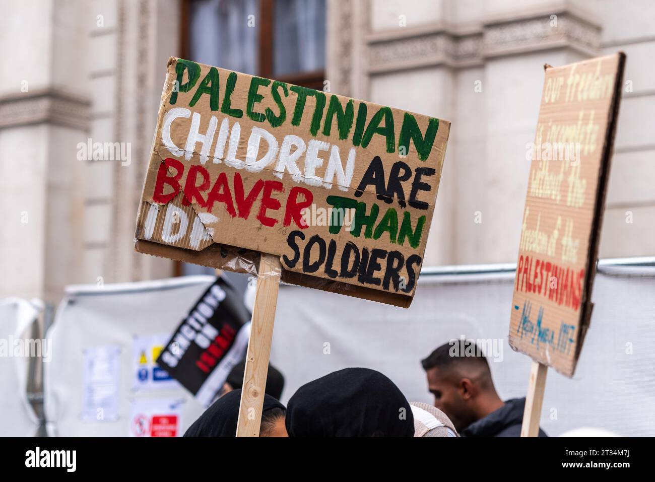 Placard referencing children and IDF soldiers at a Free Palestine ...