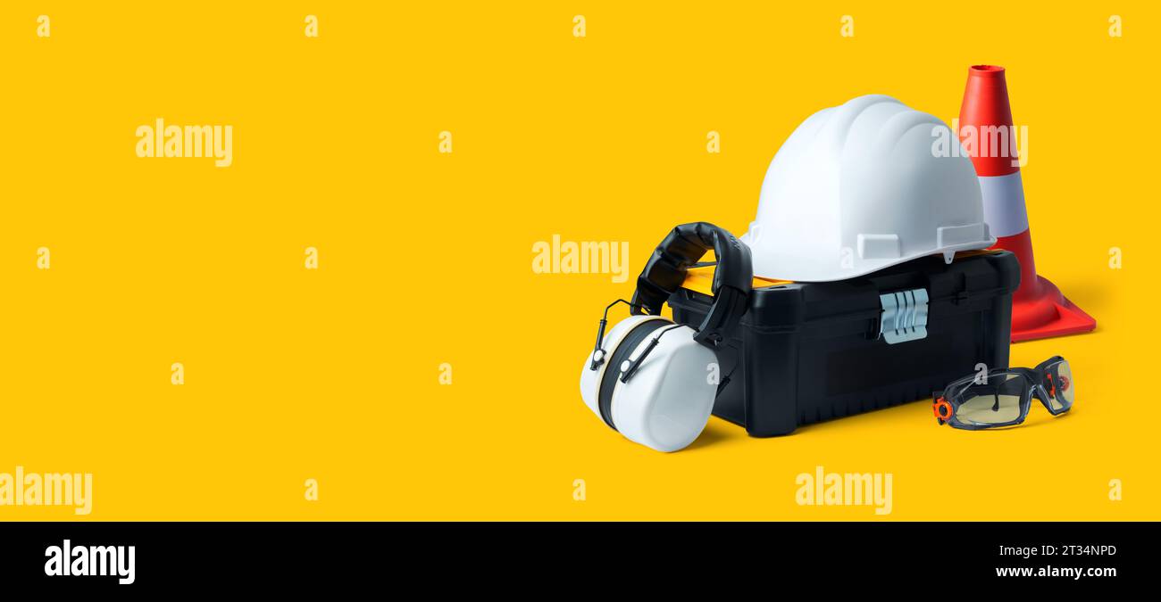 Construction worker tools and safety equipment: toolbox, hard hat, ear ...