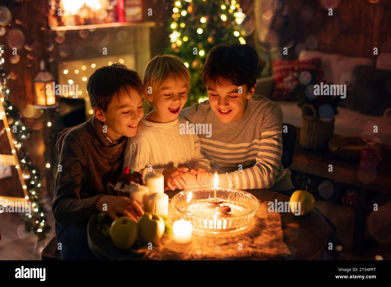 Three children, lighting candles in a nutshell, czech Christmas ...