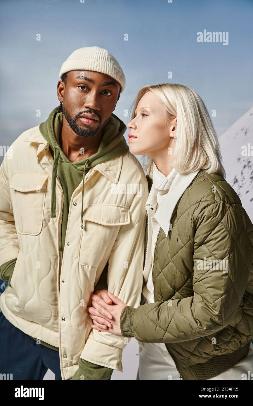 beautiful fashionable woman in warm attire holding her stylish ...