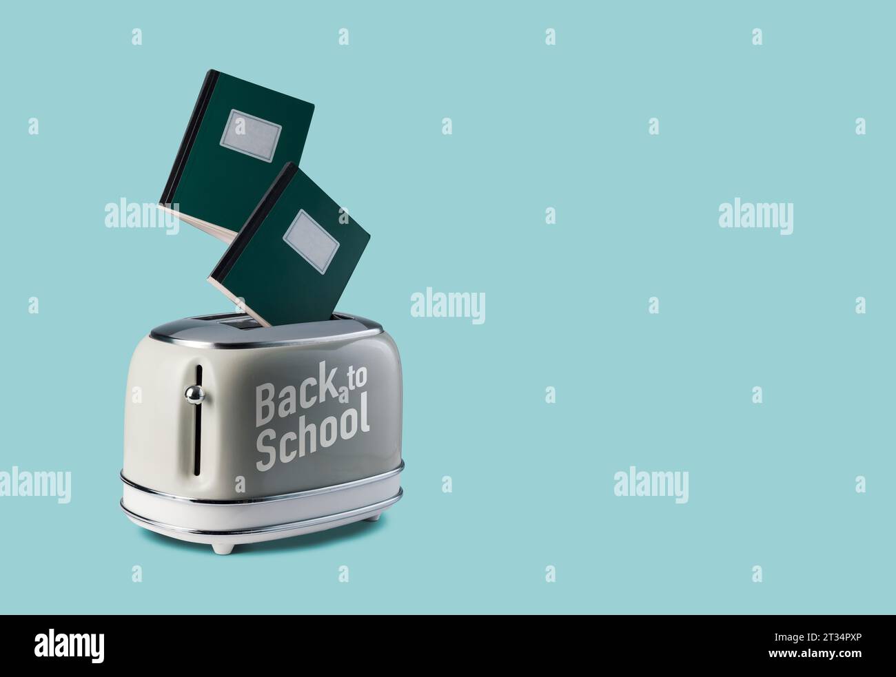 Notebooks popping out of a vintage toaster, back to school concept ...