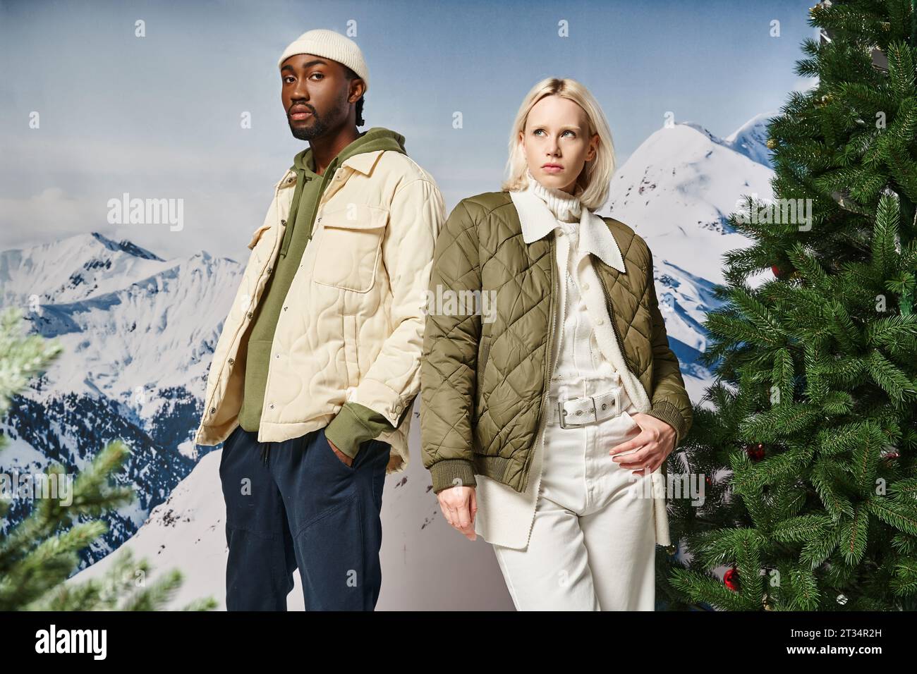 beautiful stylish couple wearing warm modish jackets and posing next to ...