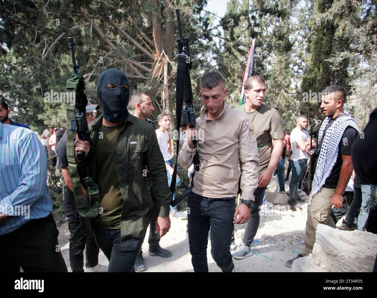 Mourners carry the bodies two Palestinian men, 29-year-old Jihad Saleh ...