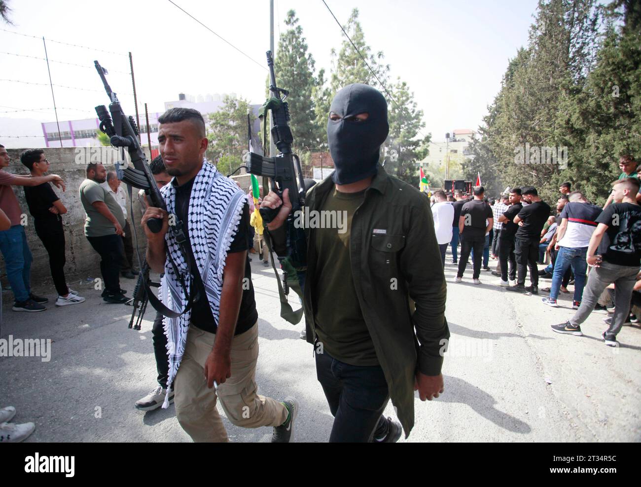 Mourners carry the bodies two Palestinian men, 29-year-old Jihad Saleh ...