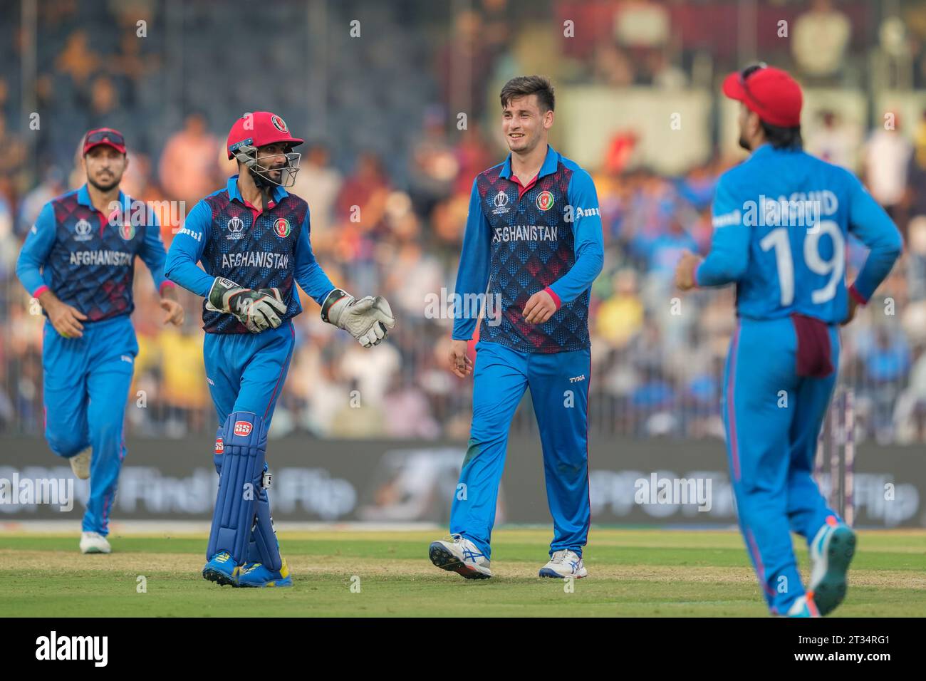 Afghanistan's Noor Ahmad, centre without cap, celebrates the dismissal ...