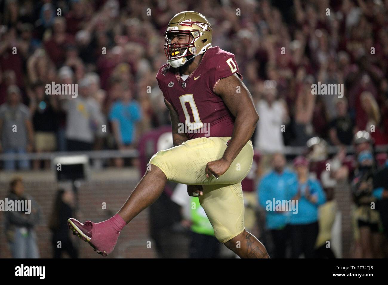 Florida State defensive lineman Fabien Lovett (0) reacts after making a ...