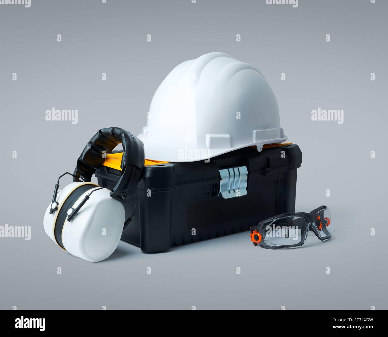 Construction worker tools and safety equipment: toolbox, hard hat, ear ...