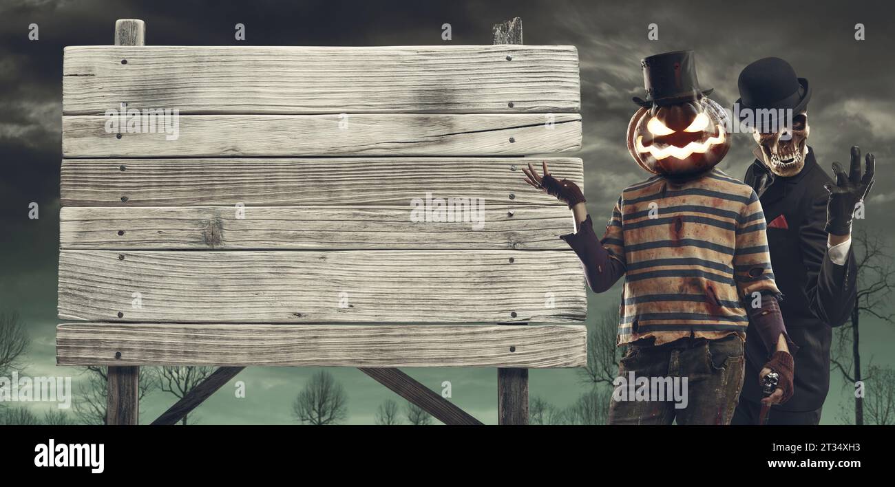 Spooky horror Halloween characters showing an old blank wooden sign ...