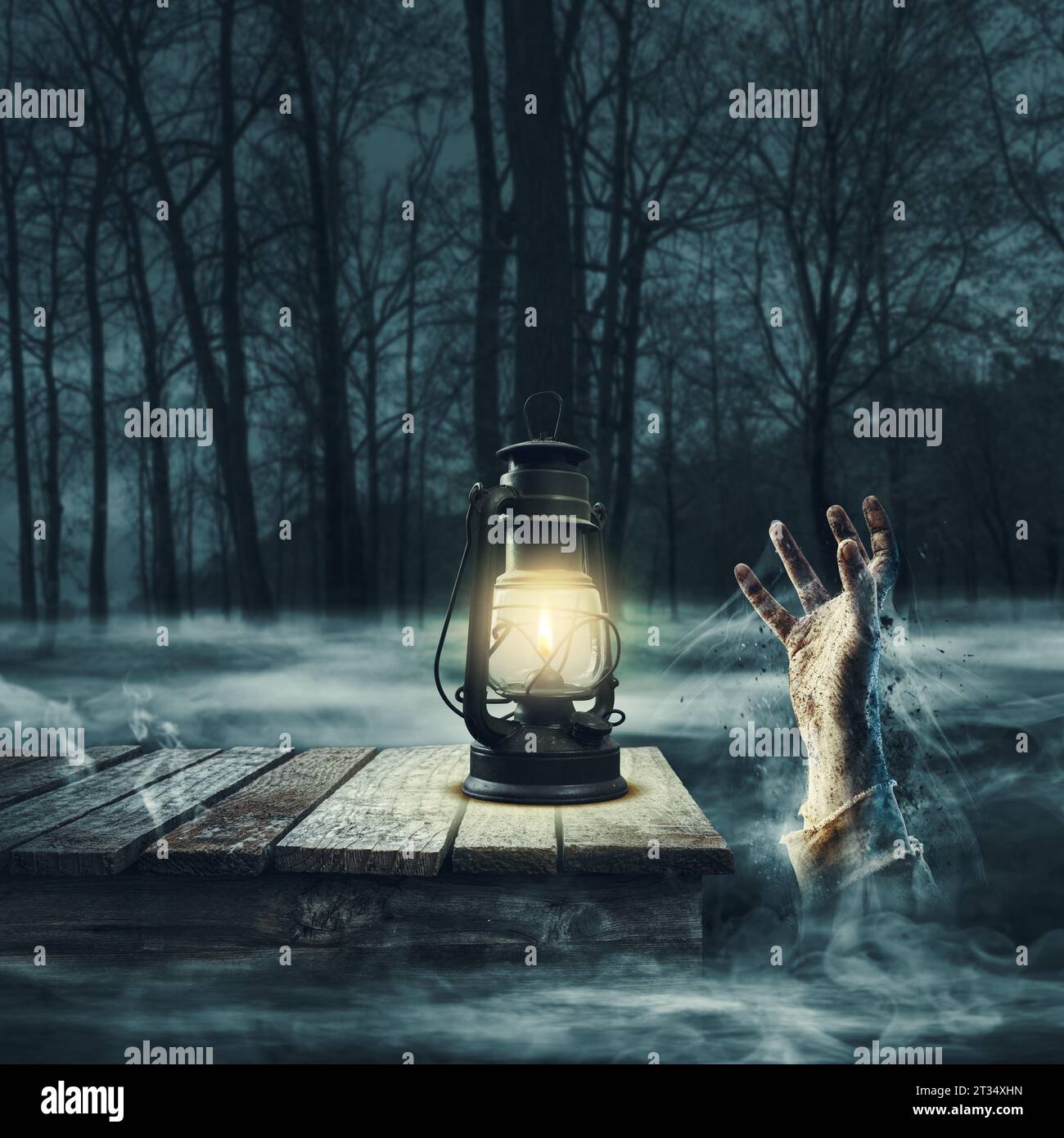 Zombie hand rising from the water and glowing lantern, horror and ...