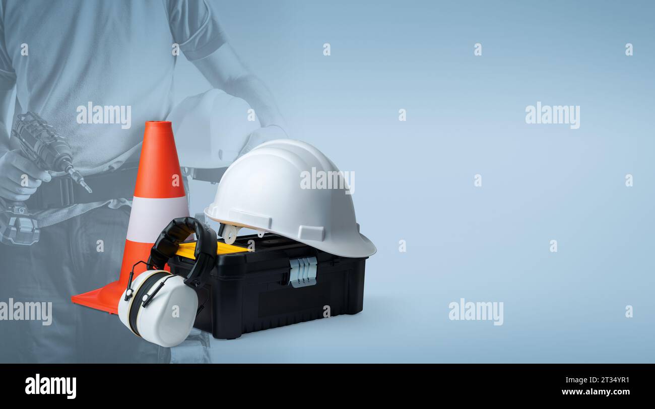 Safety helmet, ear muffs traffic cone and toolbox: personal protective ...