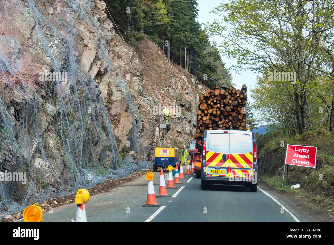 Workmen securing banking hi-res stock photography and images - Alamy