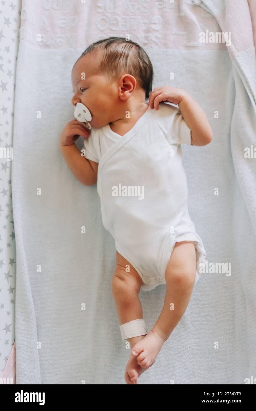 one day old newborn on a baby changer Stock Photo - Alamy