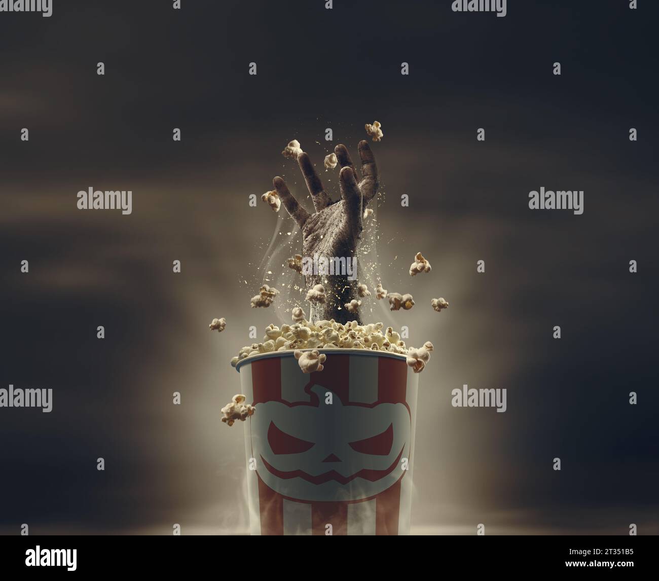 Scary zombie hand coming out of a full popcorn bucket, horror movies ...