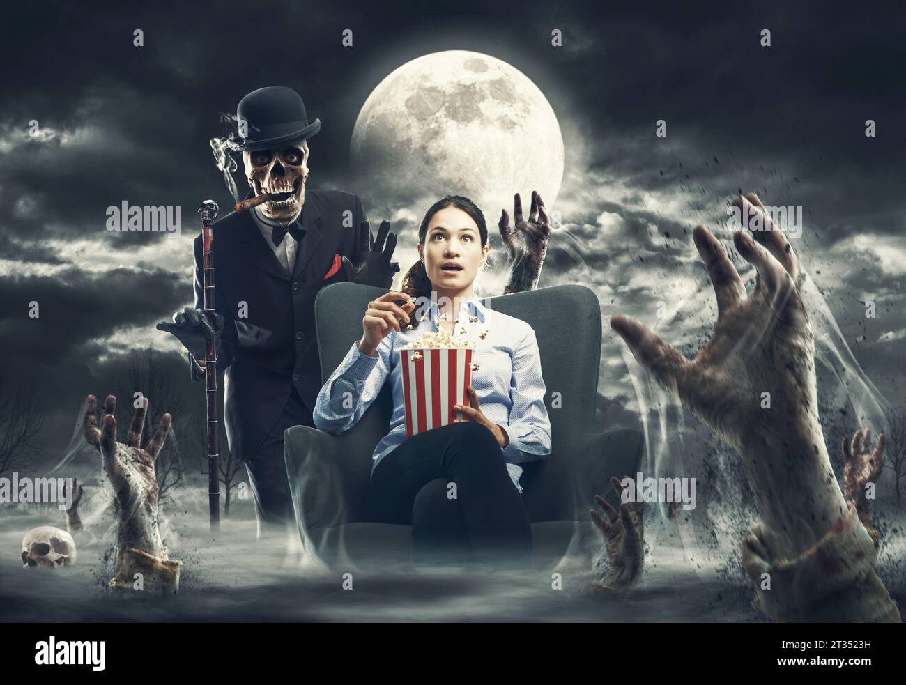 Scared woman watching horror movies and eating popcorn, she is ...