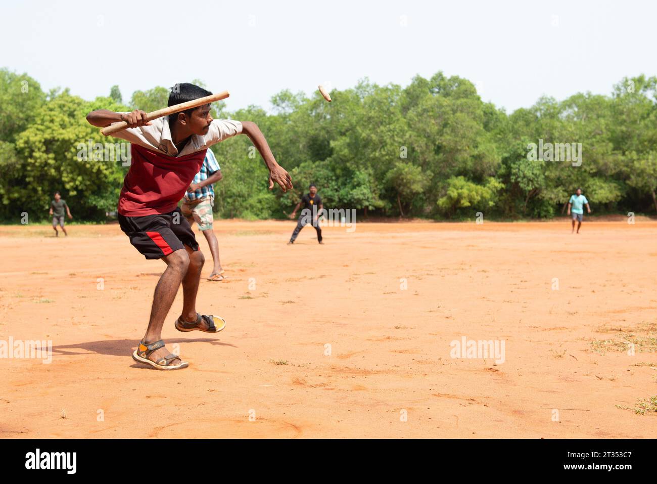 Auroville, India - August 2023: Playing Gilli Danda, the traditional ... Auroville, India - August 2023: Playing Gilli Danda, the traditional ...