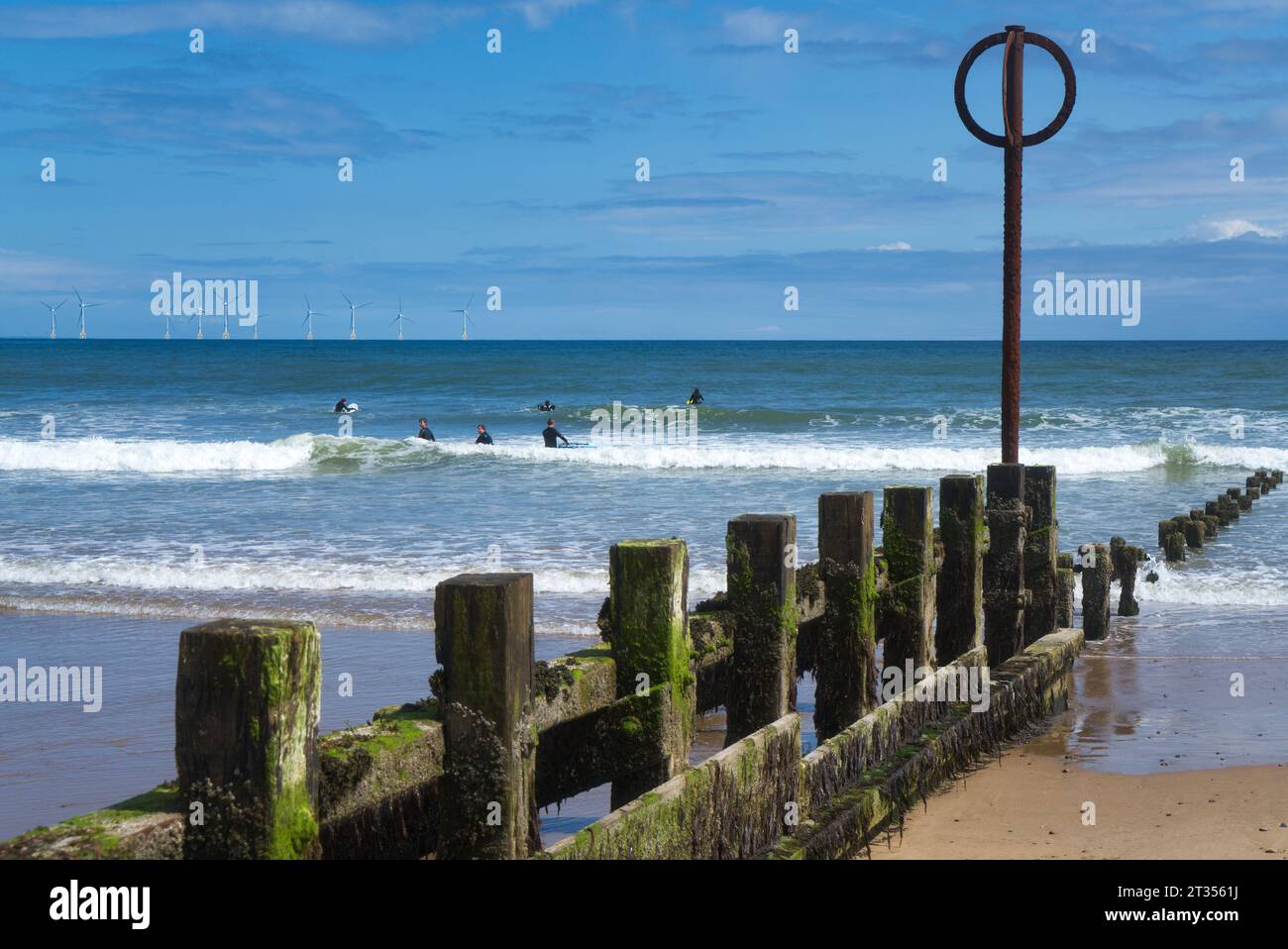 Aberdeen beach looking out to north sea,wind farm, promenade. Surfers ...
