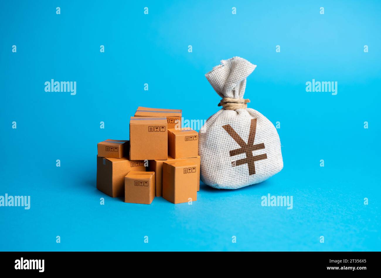 Goods boxes and yen and yuan money bag. Budget purchases, large ...