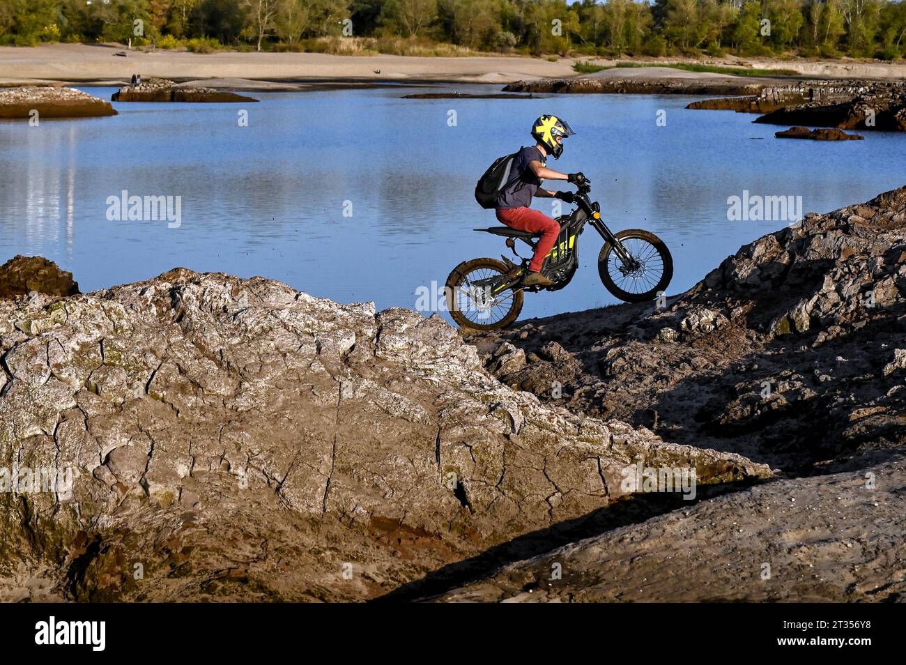 ZAPORIZHZHIA, UKRAINE - OCTOBER 5, 2023 - A motocross rider explores the terrain at the mouth of ...