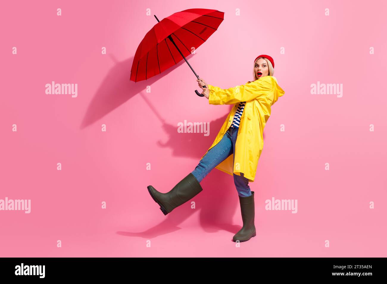 Full length photo of excited impressed lady wear raincoat holding ...