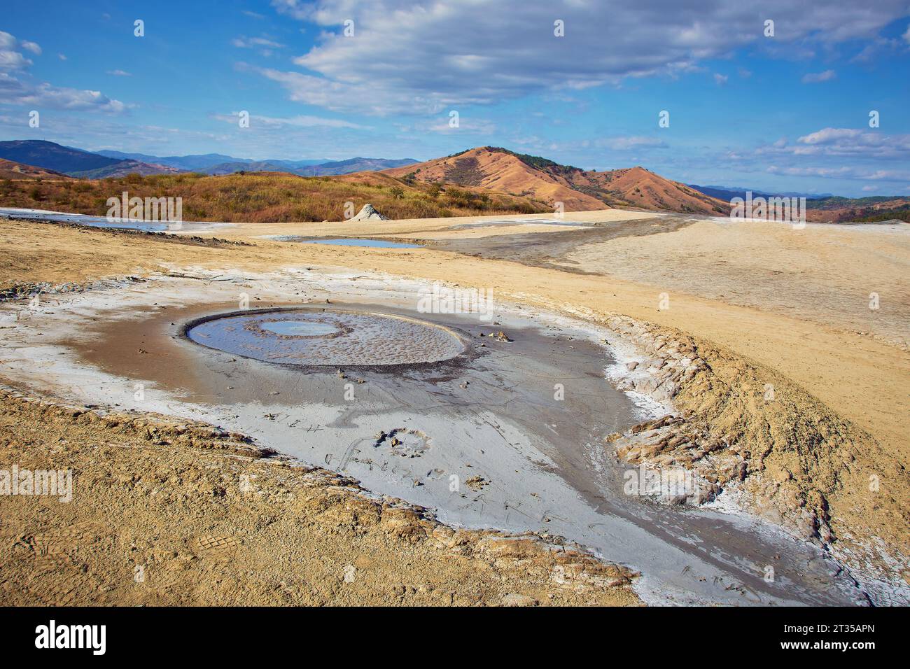 cones of mud volcanoes from which rivers of mud flow Stock Photo - Alamy