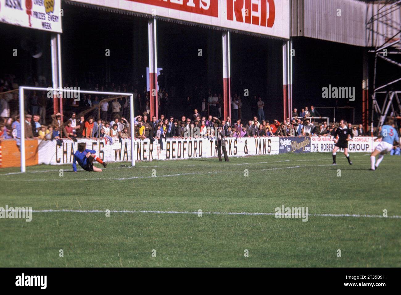 Phil Neal scoring a penalty past Peter Grotier at Lincoln Stock Photo ...