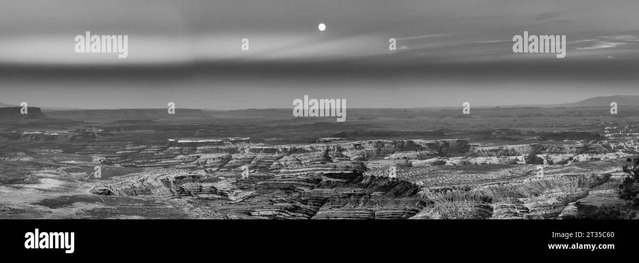 Panoramic photograph of the moon rising over Canyonlands National Park ...