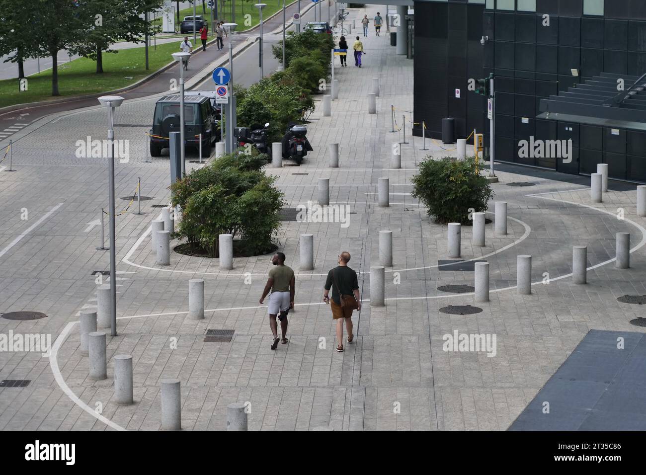 Pedestrians on cycle lane system in the city of Milan in the modern ...