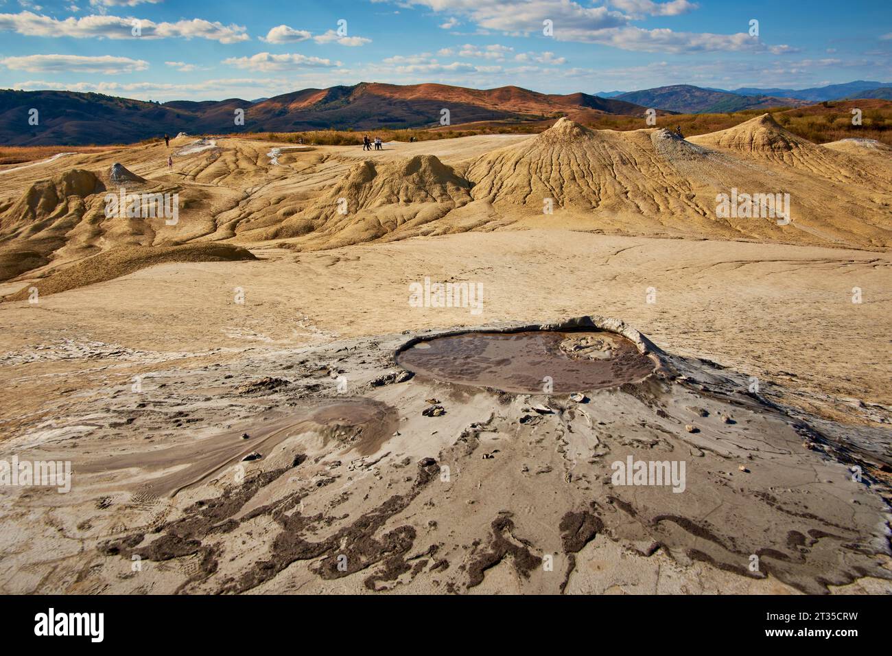 cones of mud volcanoes from which rivers of mud flow Stock Photo - Alamy