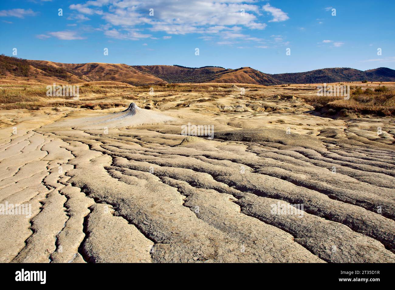 cones of mud volcanoes from which rivers of mud flow Stock Photo - Alamy