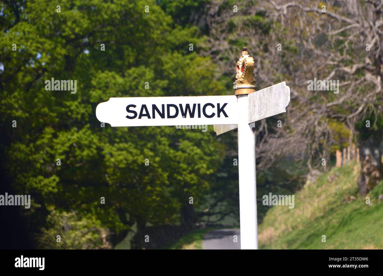White Wooden Roadside Signpost with Gold Crown for Sandwick Bay on ...