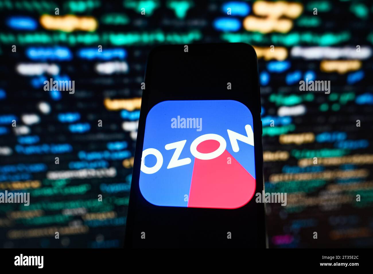 In this photo illustration, an Ozon logo seen displayed on a smartphone with coding in the ...