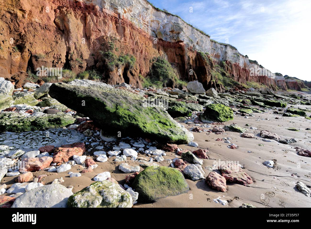 Red and white striped cliffs (carstone and chalk ) at hunstanton ...