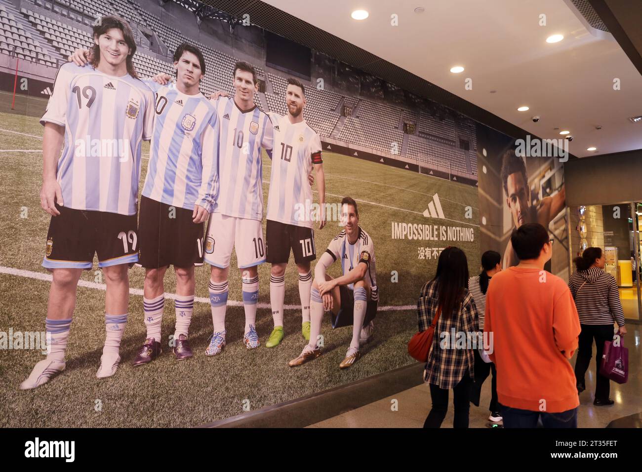 SHANGHAI, CHINA - OCTOBER 22, 2023 - Customers pass an Adidas ...