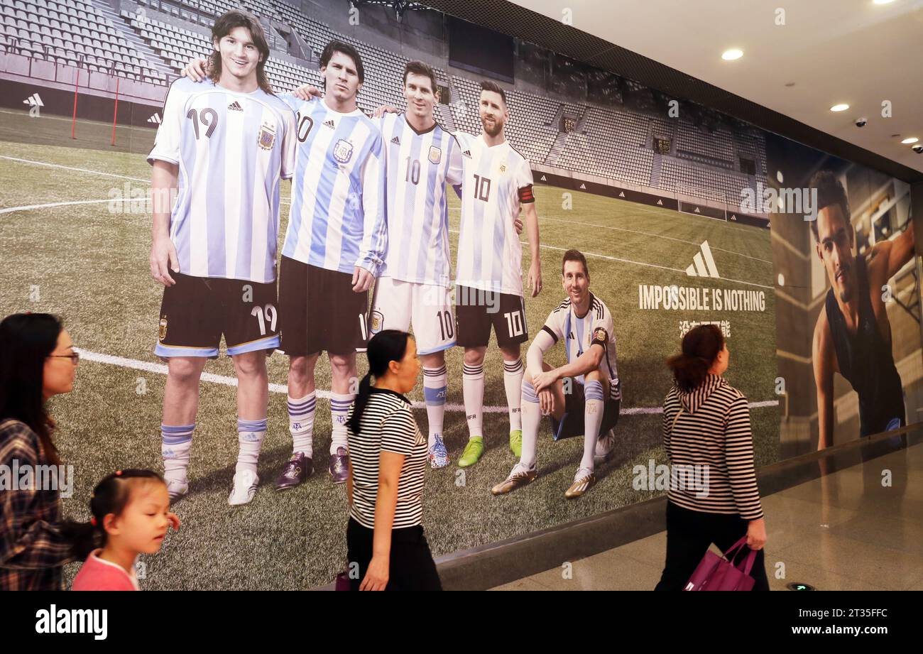 SHANGHAI, CHINA - OCTOBER 22, 2023 - Customers pass an Adidas ...