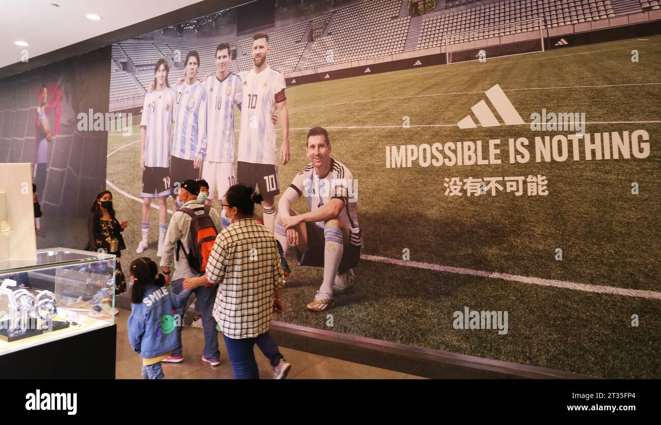 SHANGHAI, CHINA - OCTOBER 22, 2023 - Customers pass an Adidas ...