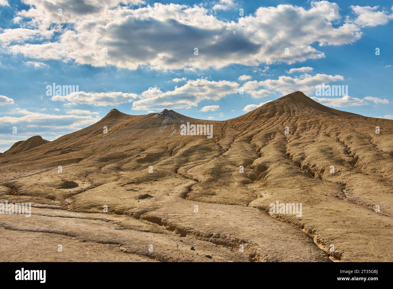 cones of mud volcanoes from which rivers of mud flow Stock Photo - Alamy