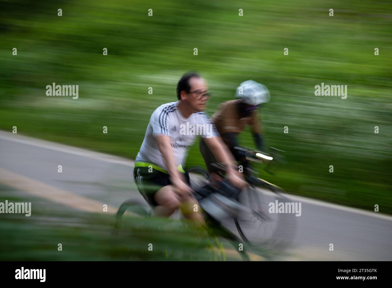 Intentional camera movement blur of speeding cyclists on Hangang Han ...